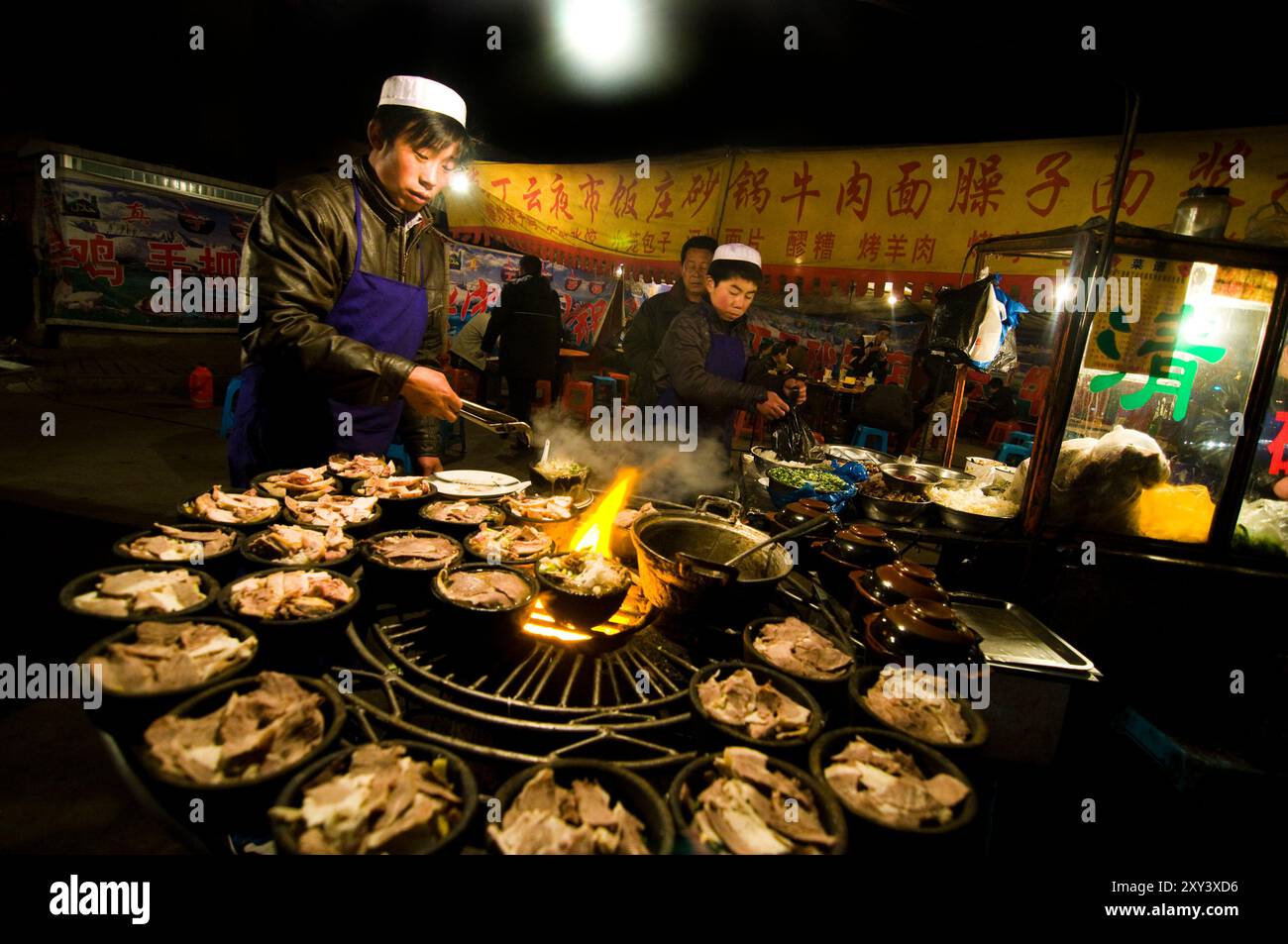 The vibrant night market in Linxia, Gansu province, China Stock Photo ...