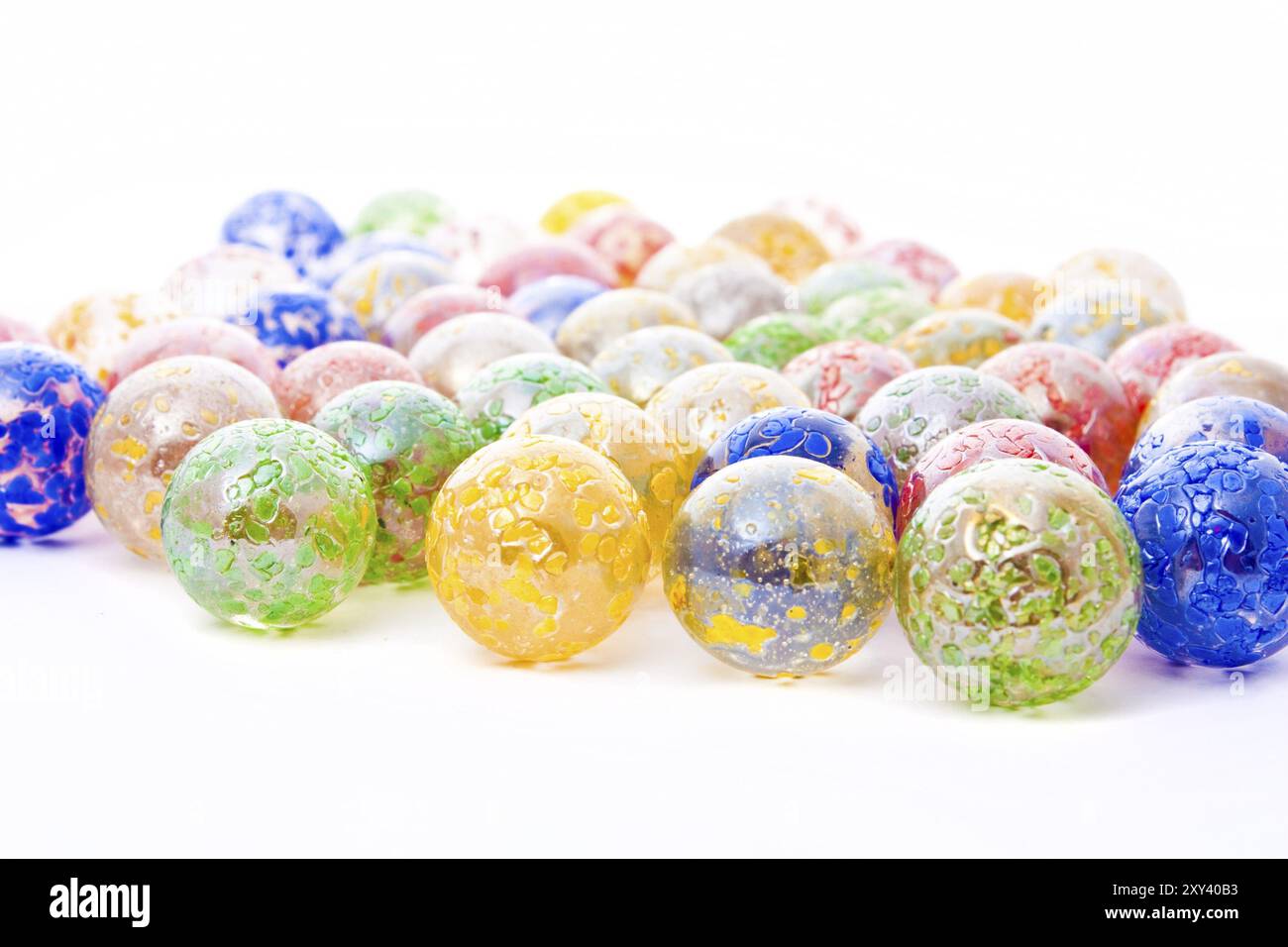 Colorful decorative glass balls isolated on white Stock Photo - Alamy