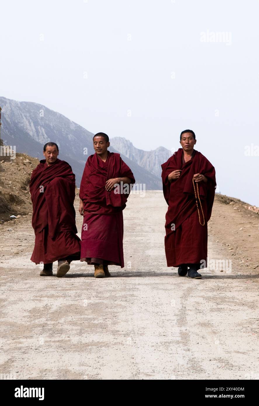 Tibetan Buddhist monks walking towards the Labrang monastery, Xiahe ...