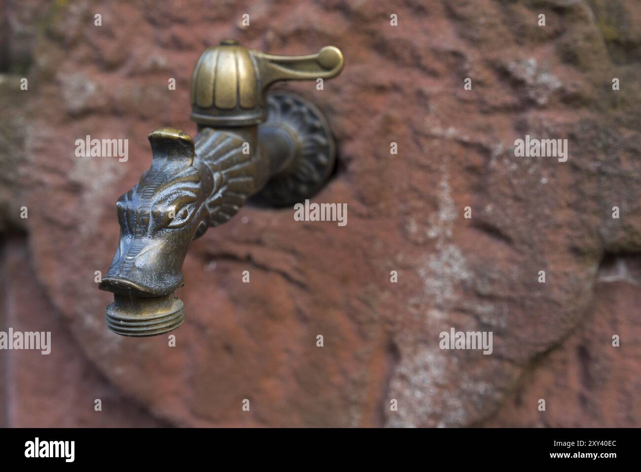 Original tap on a sandstone wall Stock Photo - Alamy