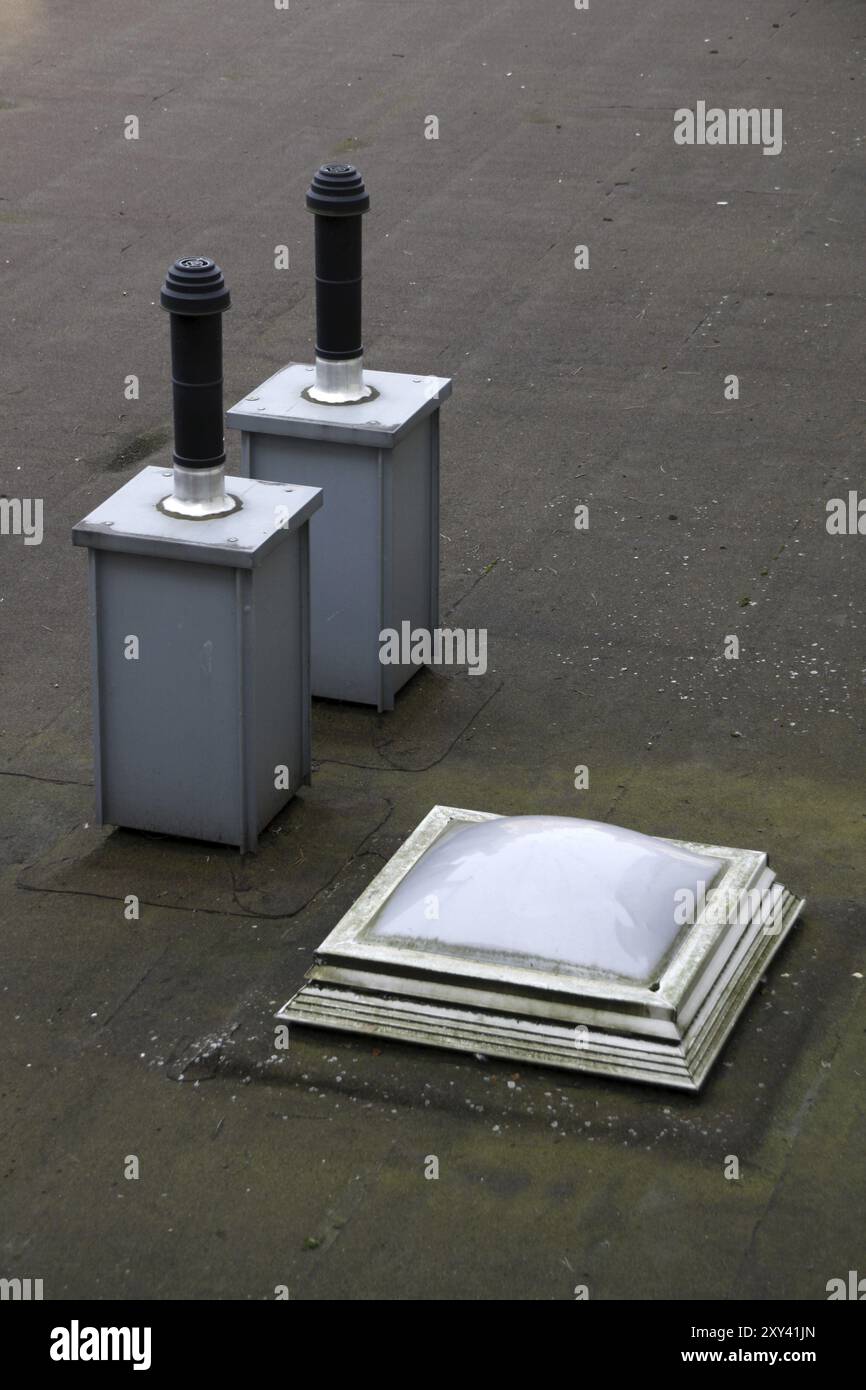 Skylight and chimneys on a flat roof Stock Photo - Alamy
