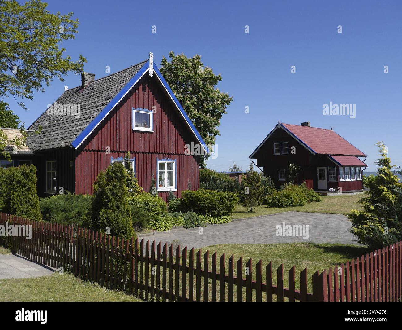 Wooden houses in Preila on the lagoon in Lithuania Stock Photo - Alamy