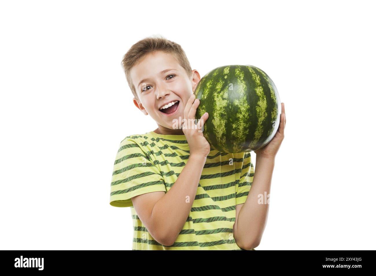 Handsome smiling child boy hand holding green ripe watermelon fruit ...