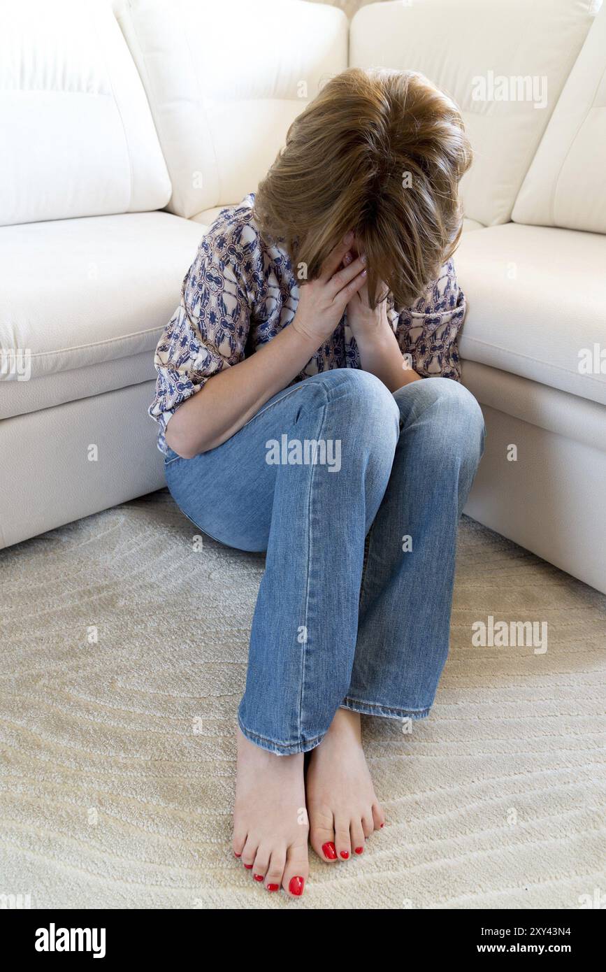 Woman crying covering her face with a hands Stock Photo - Alamy