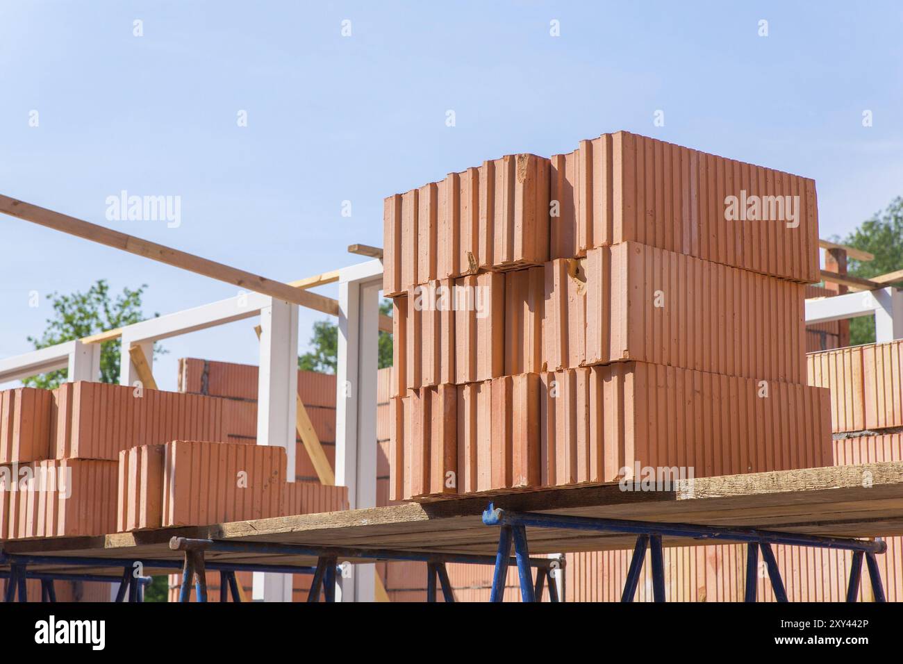 Stack of building bricks on construction site Stock Photo - Alamy