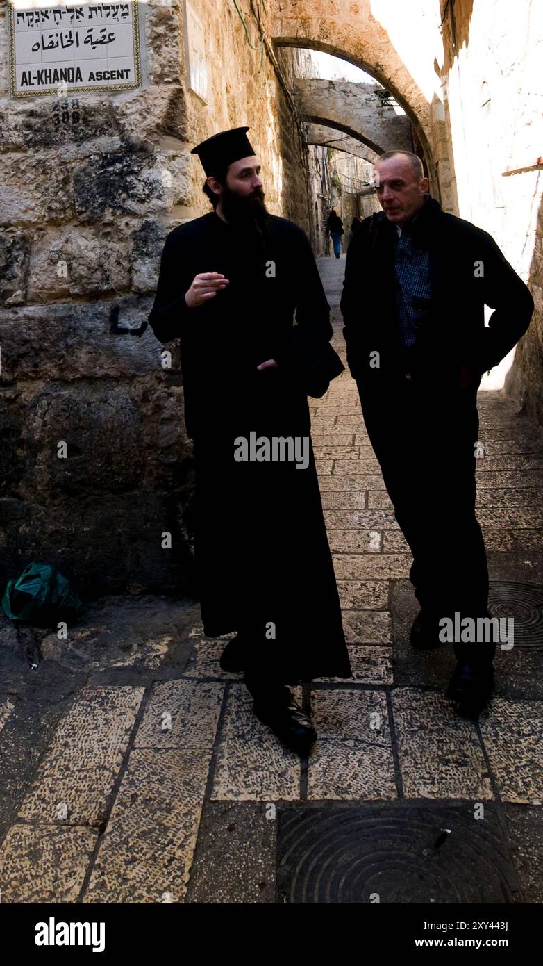 Priests walking in street hi-res stock photography and images - Alamy