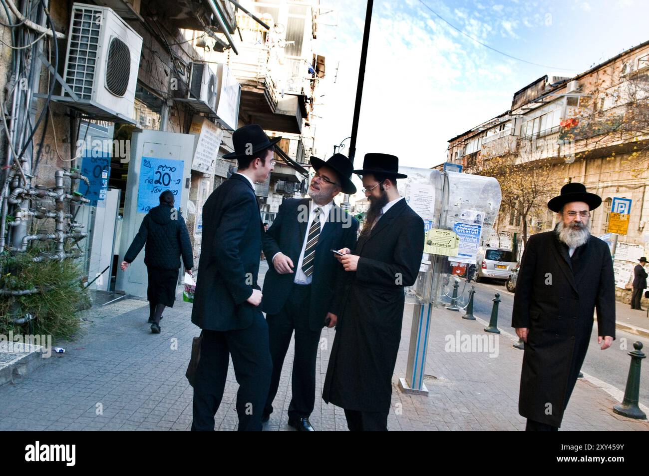 Haredi Jewish men socializing in the Geula ultra-Orthodox neighborhood ...