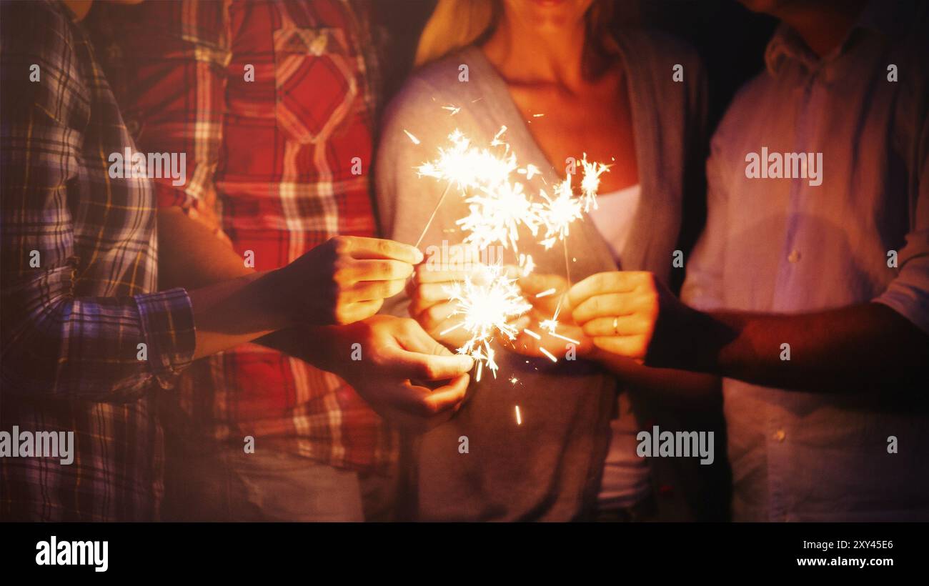 Group of anonymous people in casual clothes burning bright sparkles ...