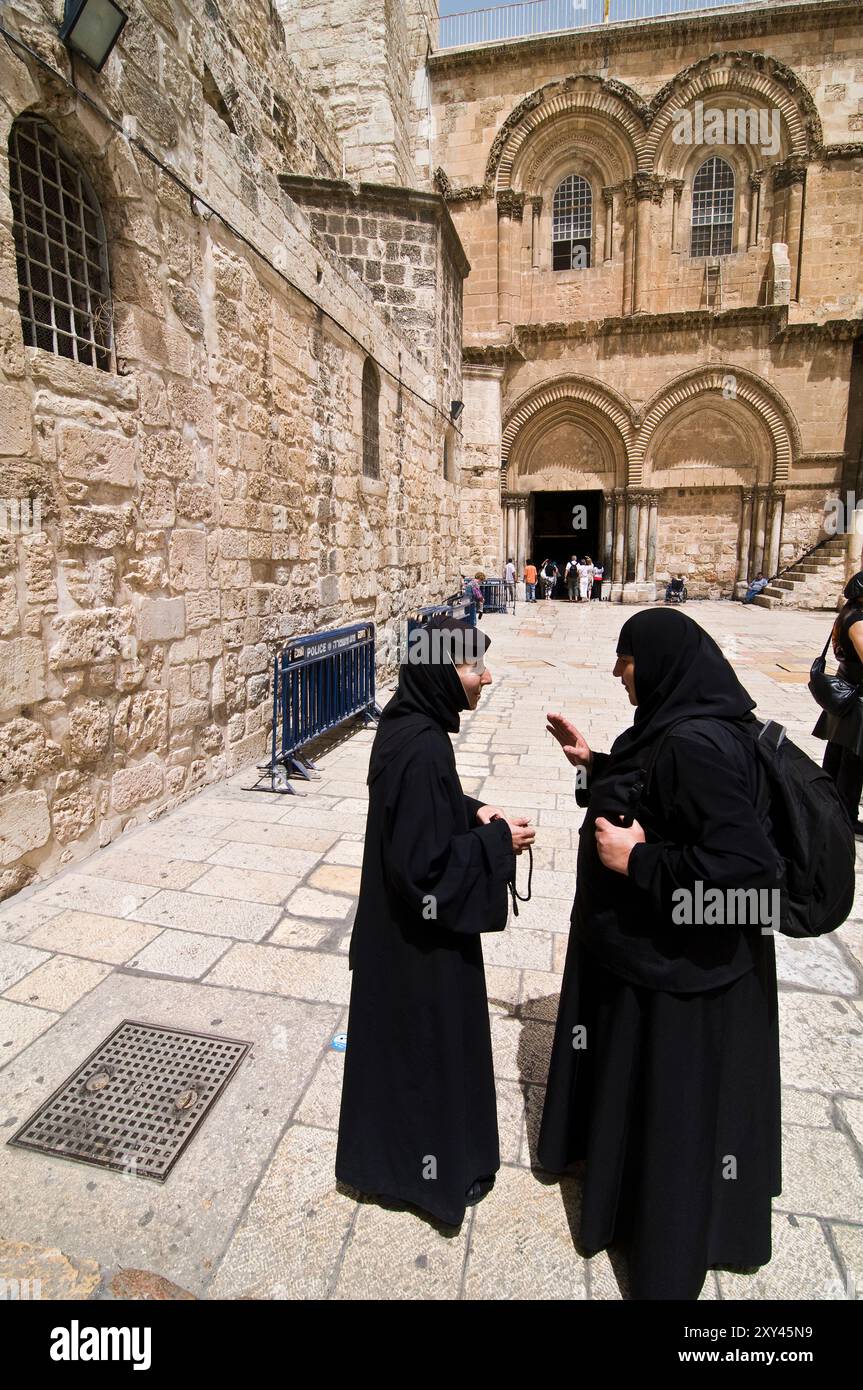 Greek Orthodox nuns socializing outside the church of the holy ...