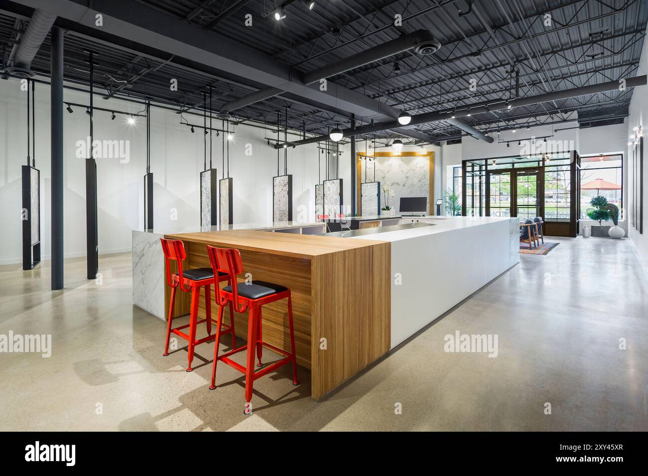 View toward front door of marble and stone showroom with large island ...