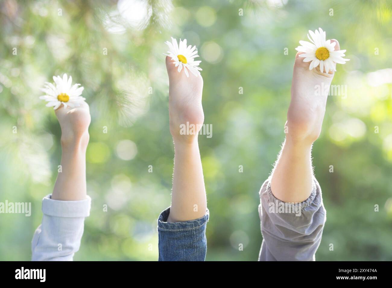 Group of happy children playing outdoors in spring park Stock Photo - Alamy