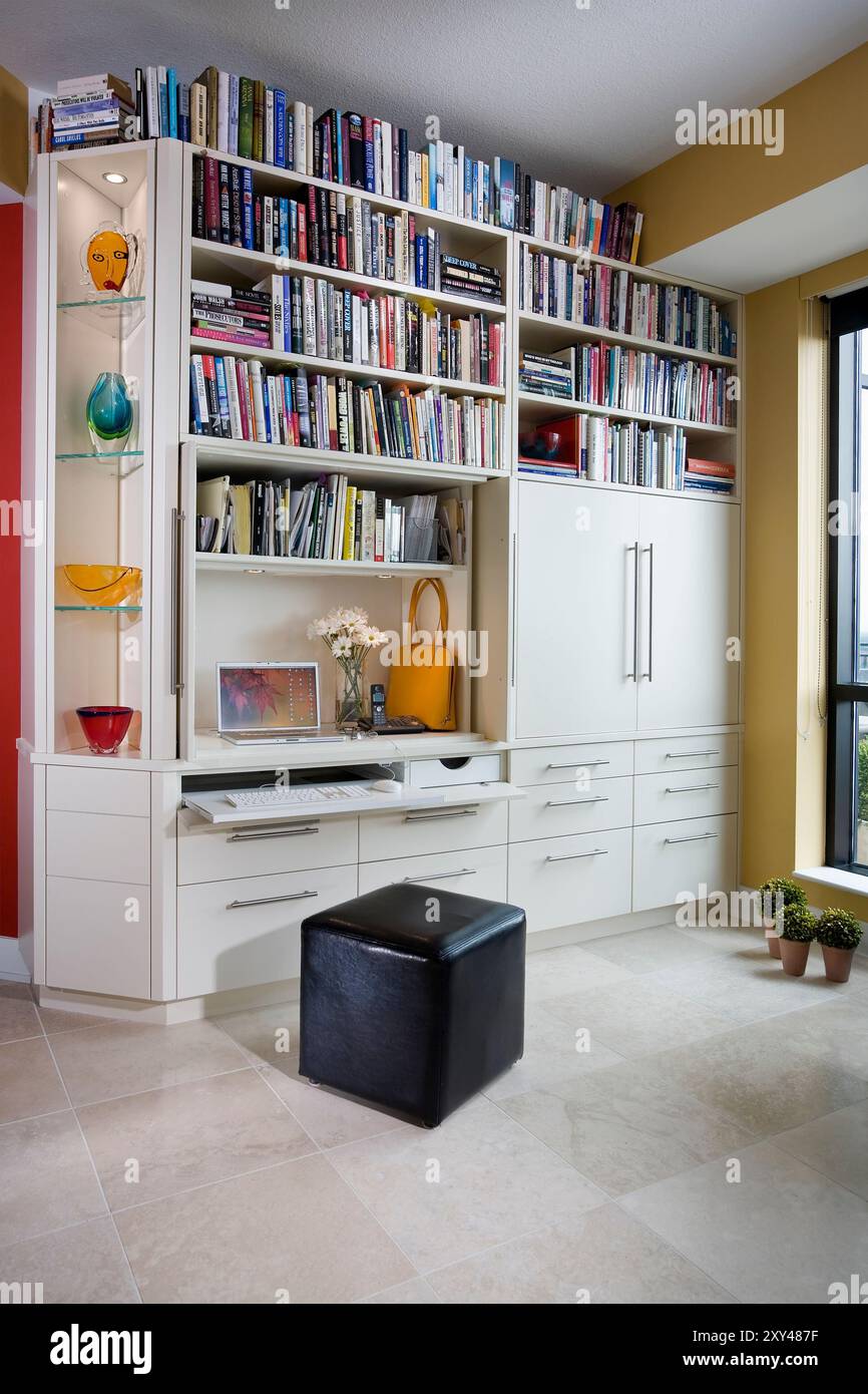 In home office with built in bookshelves, storage and desk area Stock ...