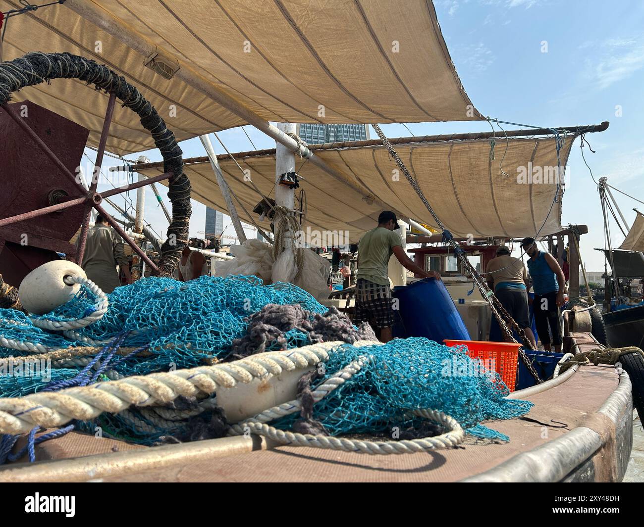 Kuwait City, Kuwait. 07th Aug, 2024. Fishermen bring their catch from a ...