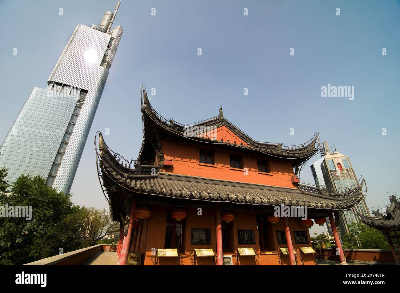 An old Chinese building at the Gulou with the modern Zifeng tower in ...
