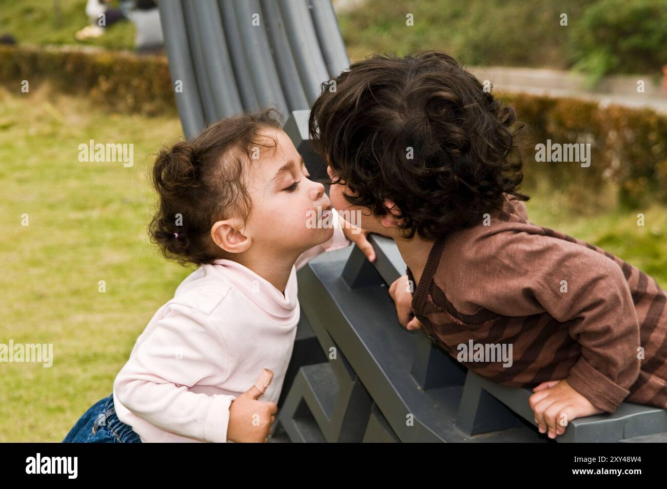 Cute toddler twins kissing Stock Photo - Alamy