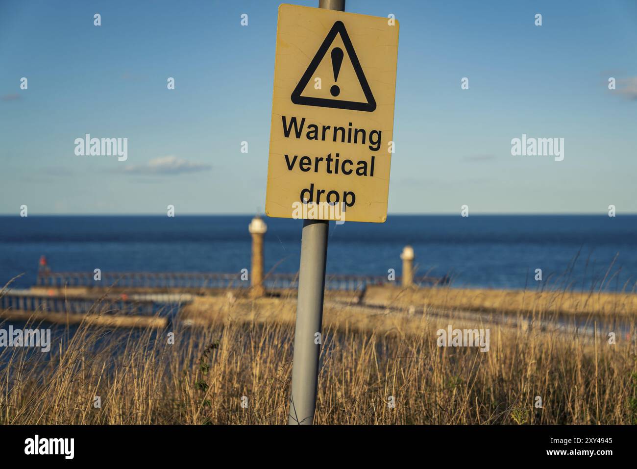 Sign: Warning vertical drop, seen in Whitby, North Yorkshire, England ...