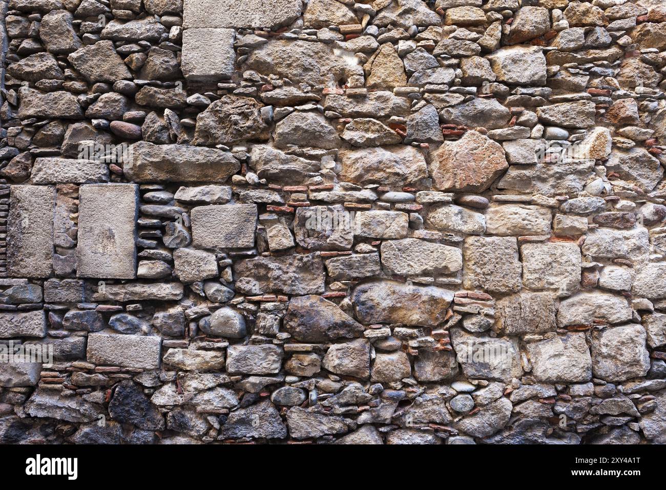 Medieval stone wall background or texture made with different sizes of ...