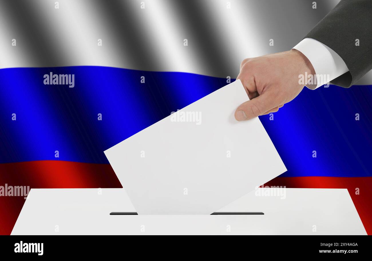 The Russian flag and the hand with the bulletin about the ballot box ...