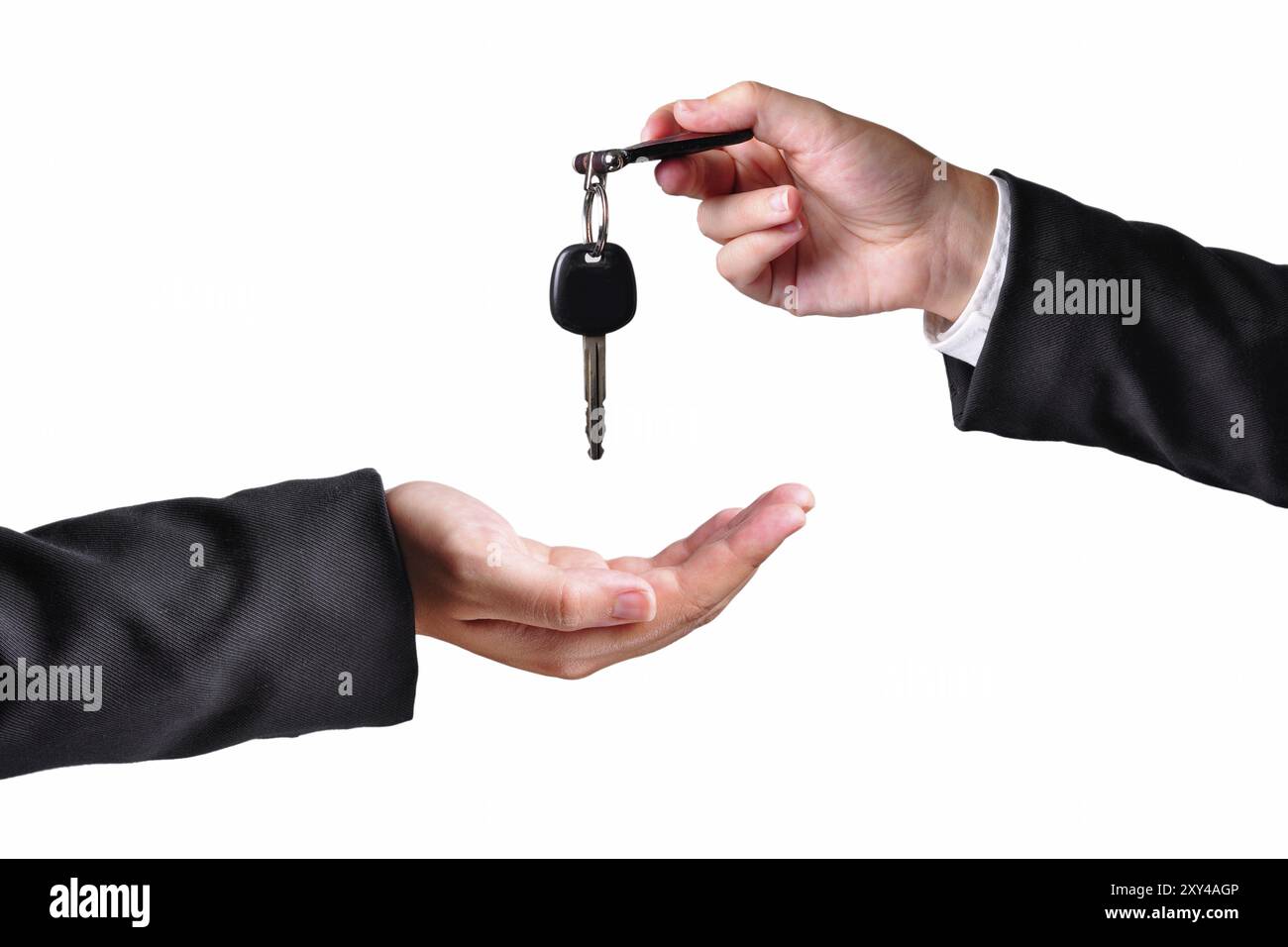A hand giving a key to another hand. Both persons in suits. Isolated ...