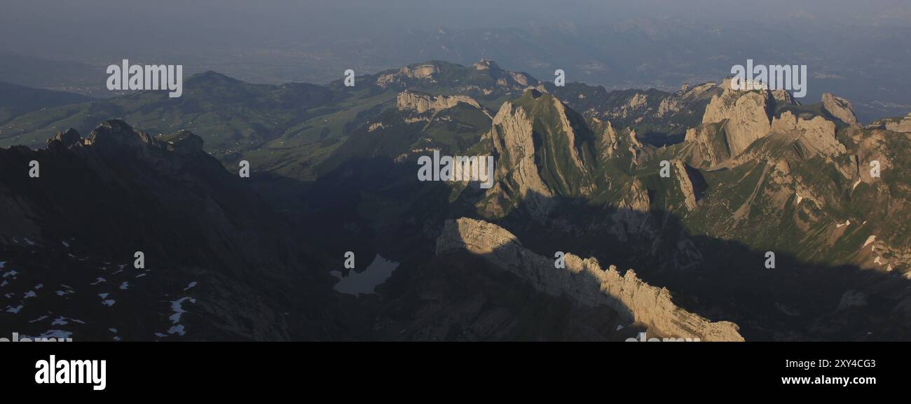 Panoramic view from Mount Santis. Lake Seealpsee and mountains of the ...