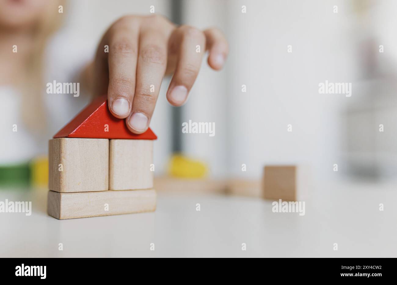 Little child girl of preschooler age playing wooden building blocks at ...