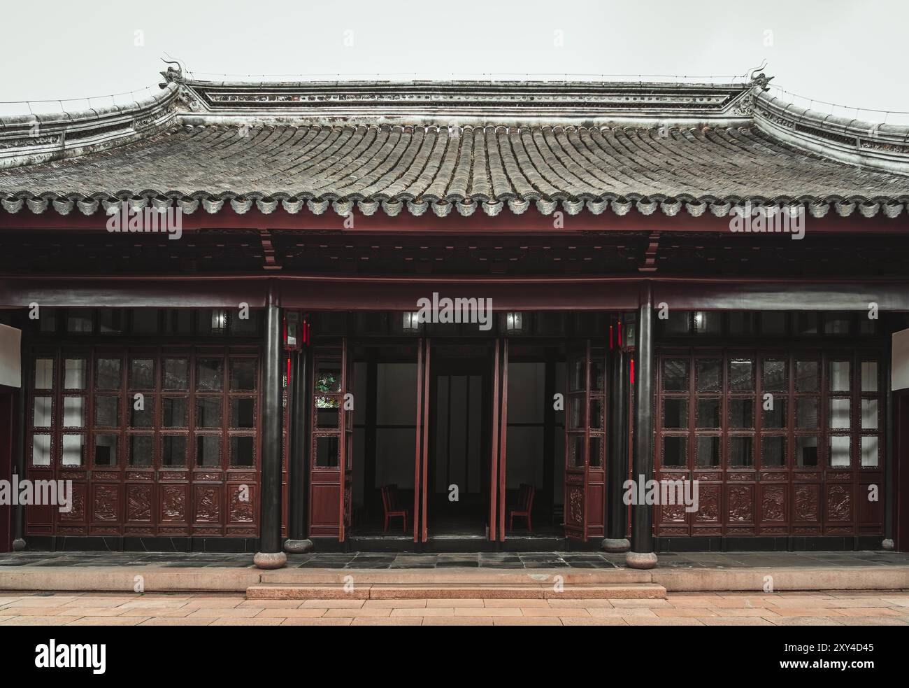A traditional Chinese building with a curved roof and intricately ...