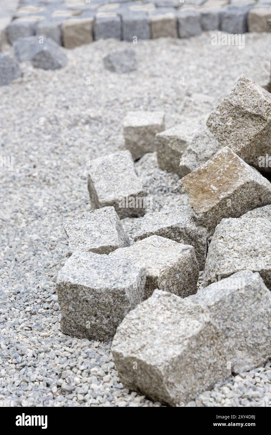 Laying granite stones Stock Photo - Alamy