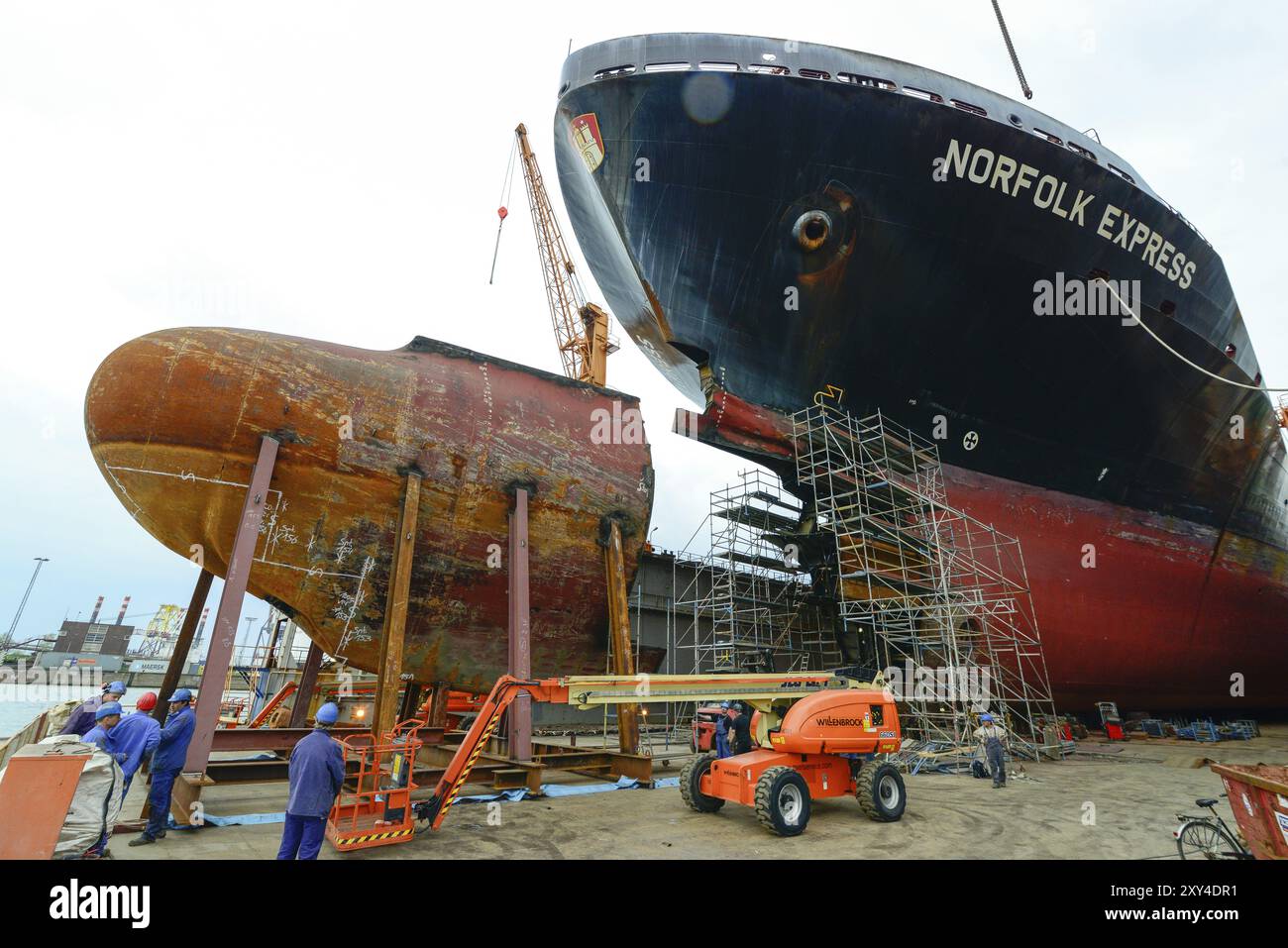 Welding and cutting work on a ship's hull in dockyard. Welding and ...