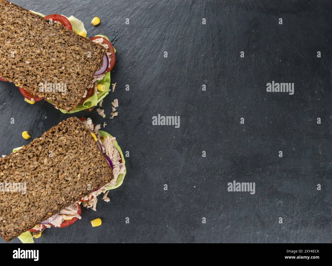 Slate slab with a Tuna Sandwich (wholemeal bread, selective focus ...