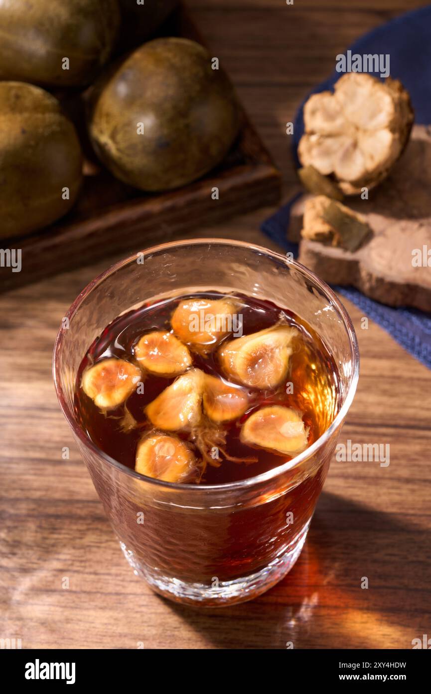 A cup of brewed monk fruit drink, a traditional Chinese medicine Stock ...