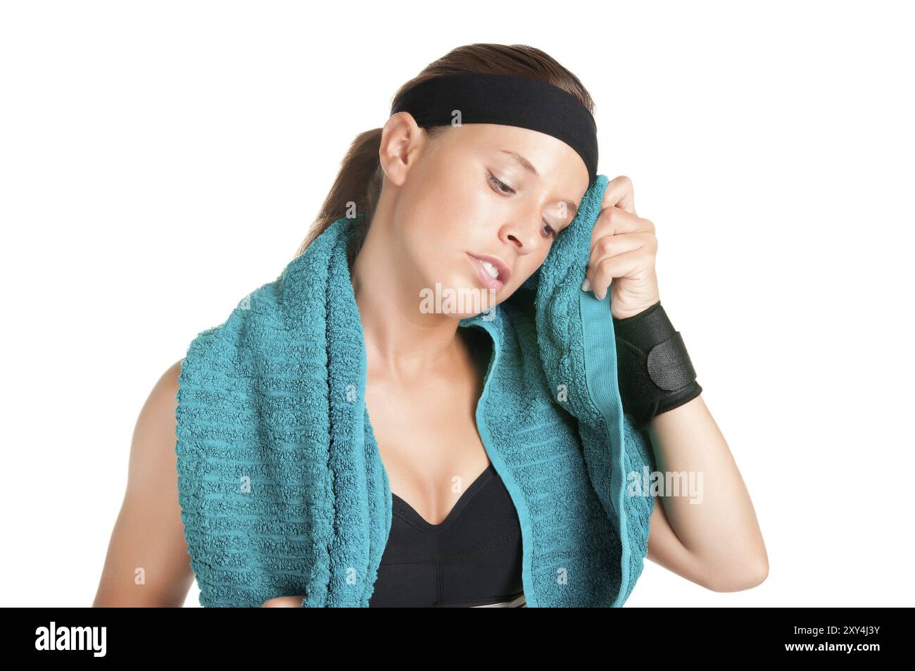 Woman resting and cleaning up her face after a fitness workout Stock ...