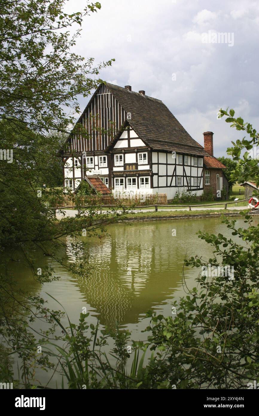Historic bakery by a village pond Stock Photo - Alamy