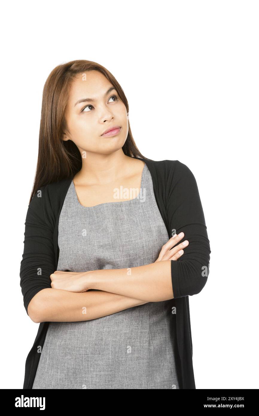 A lovely, modern Asian woman with serious, curious facial expression ...