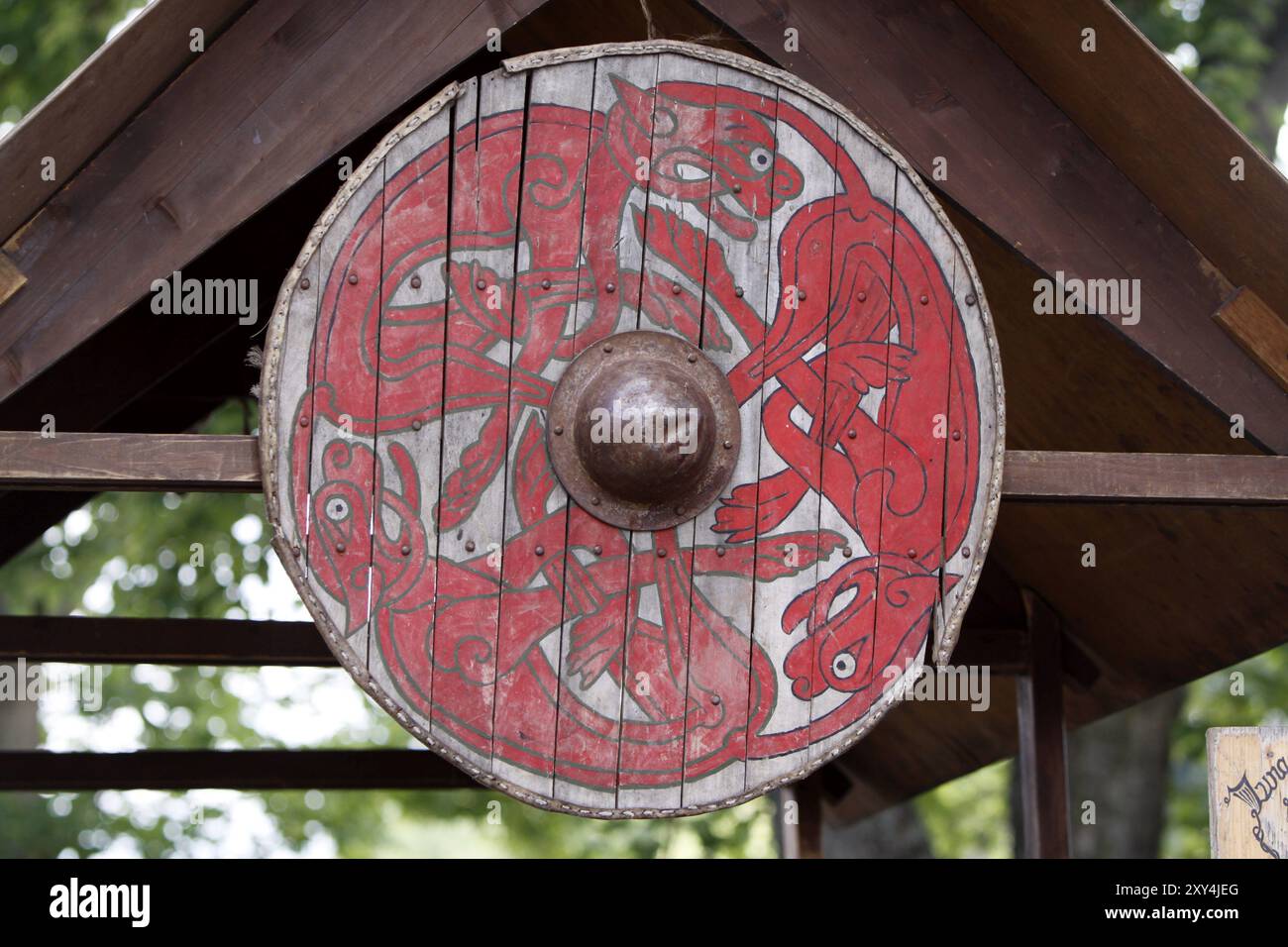 Sign with mythical creatures at a medieval market Stock Photo - Alamy