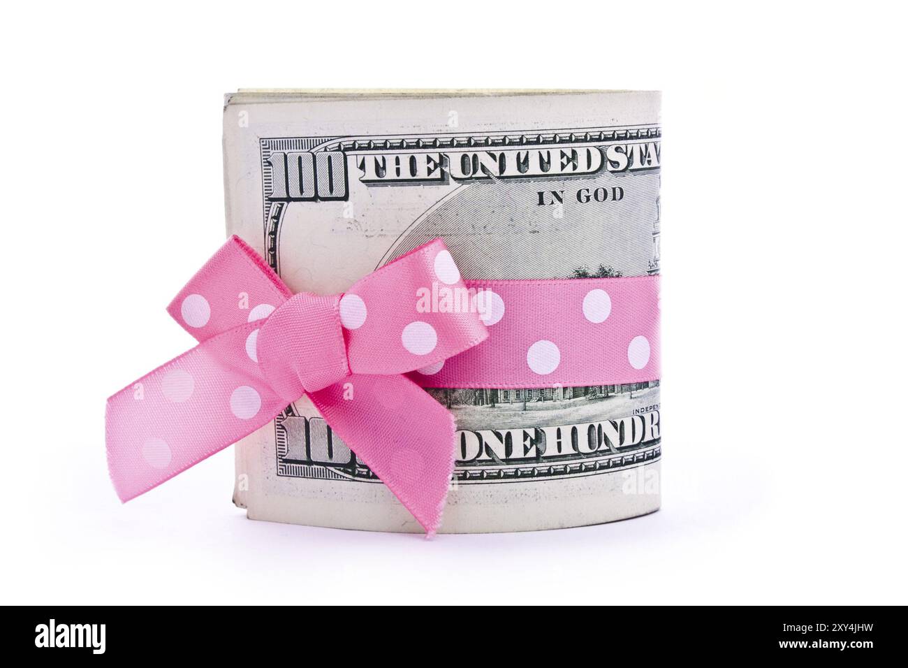 A stack of 100-dollar bills with a holiday bow isolated on white Stock ...