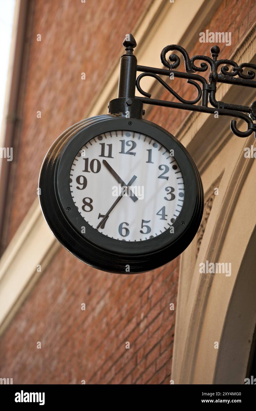 Old clock on a house Stock Photo - Alamy