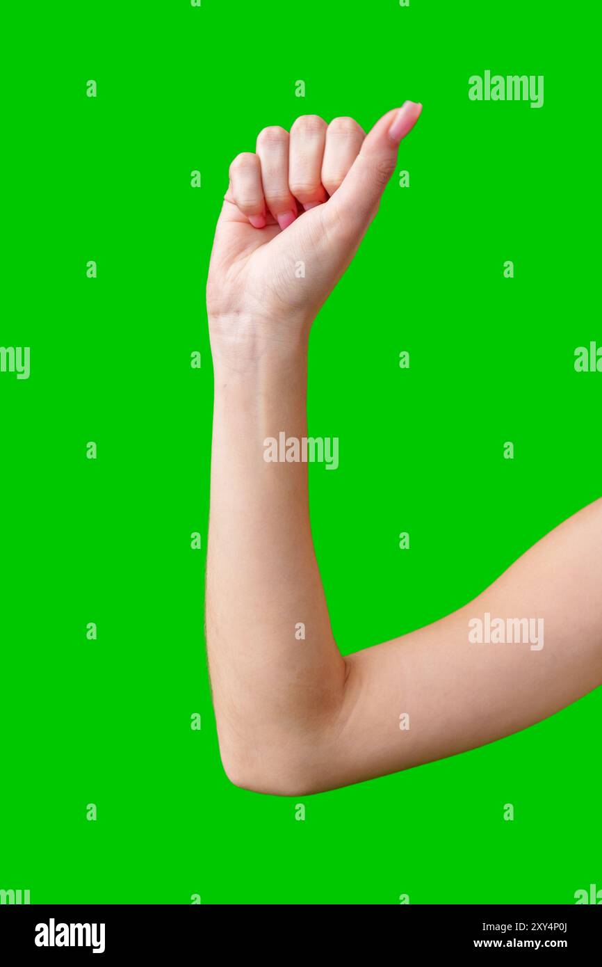 Woman's Arm With Fist Raised Against Green Screen Stock Photo - Alamy