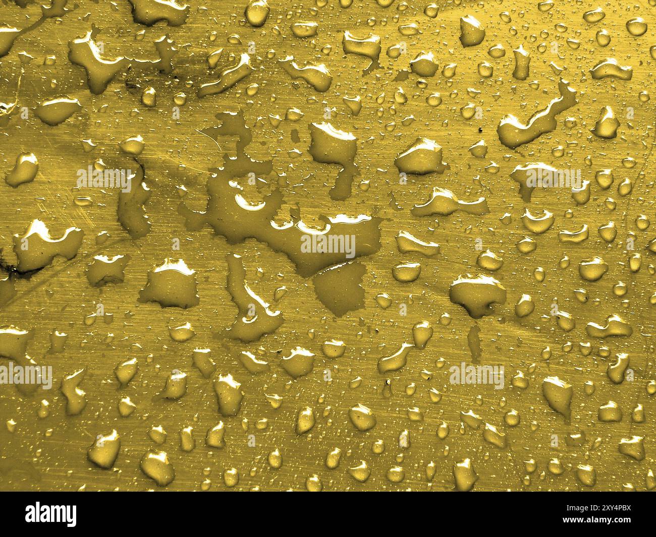 Water drops on golden color metallic surface Stock Photo - Alamy