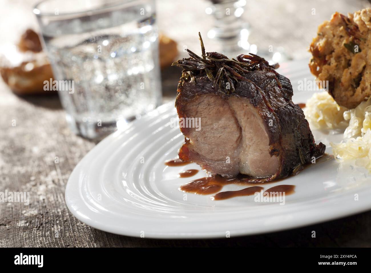 Roast suckling pig with bread dumplings Stock Photo - Alamy