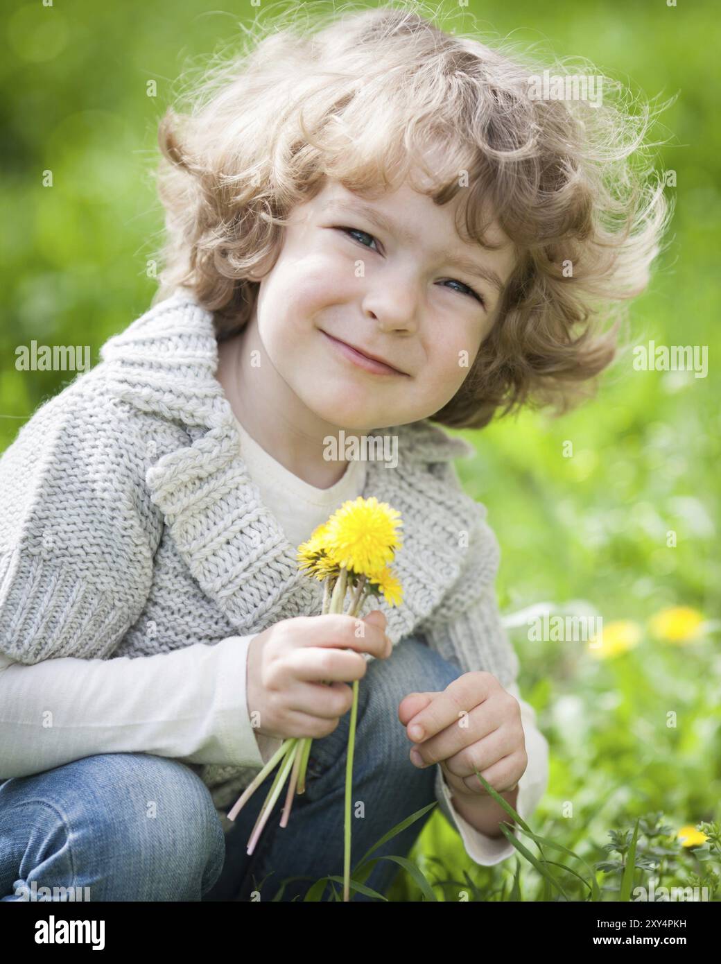 Hands child holding flowering hi-res stock photography and images - Alamy