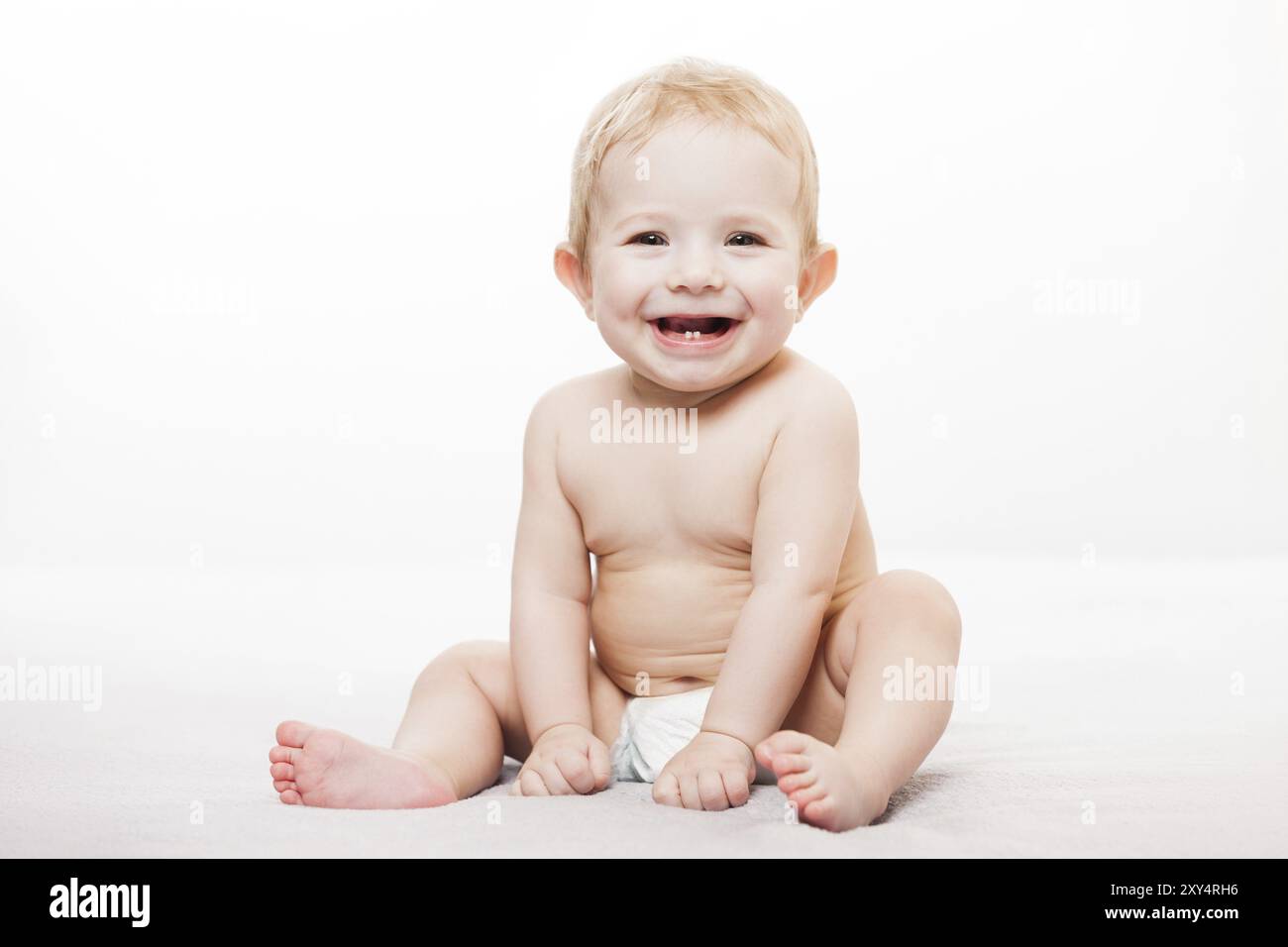 Little cute newborn baby child first milk or temporary teeth smiling ...