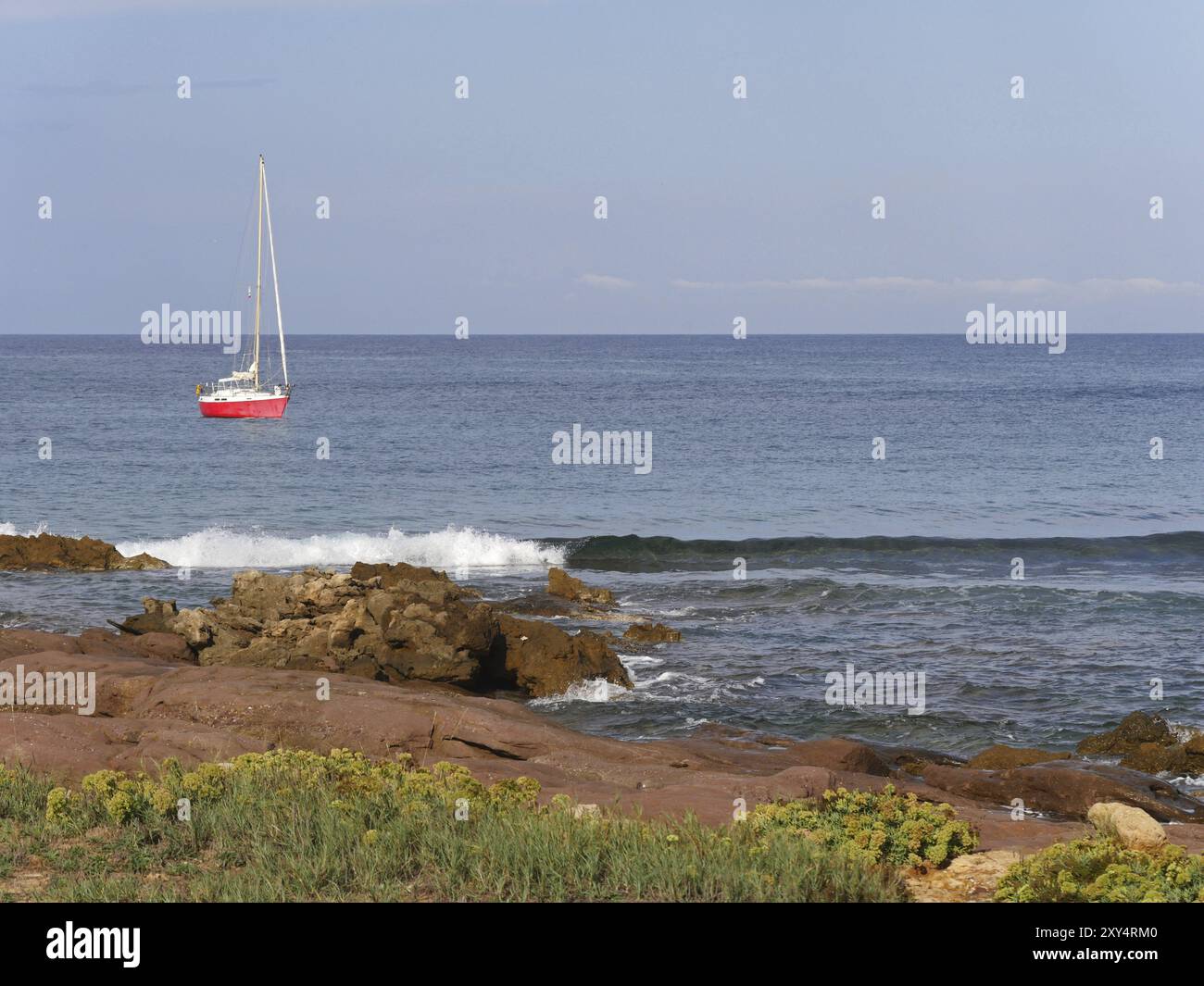 Sailboat anchors in the beautiful bay of Porto Ferro in the northwest ...
