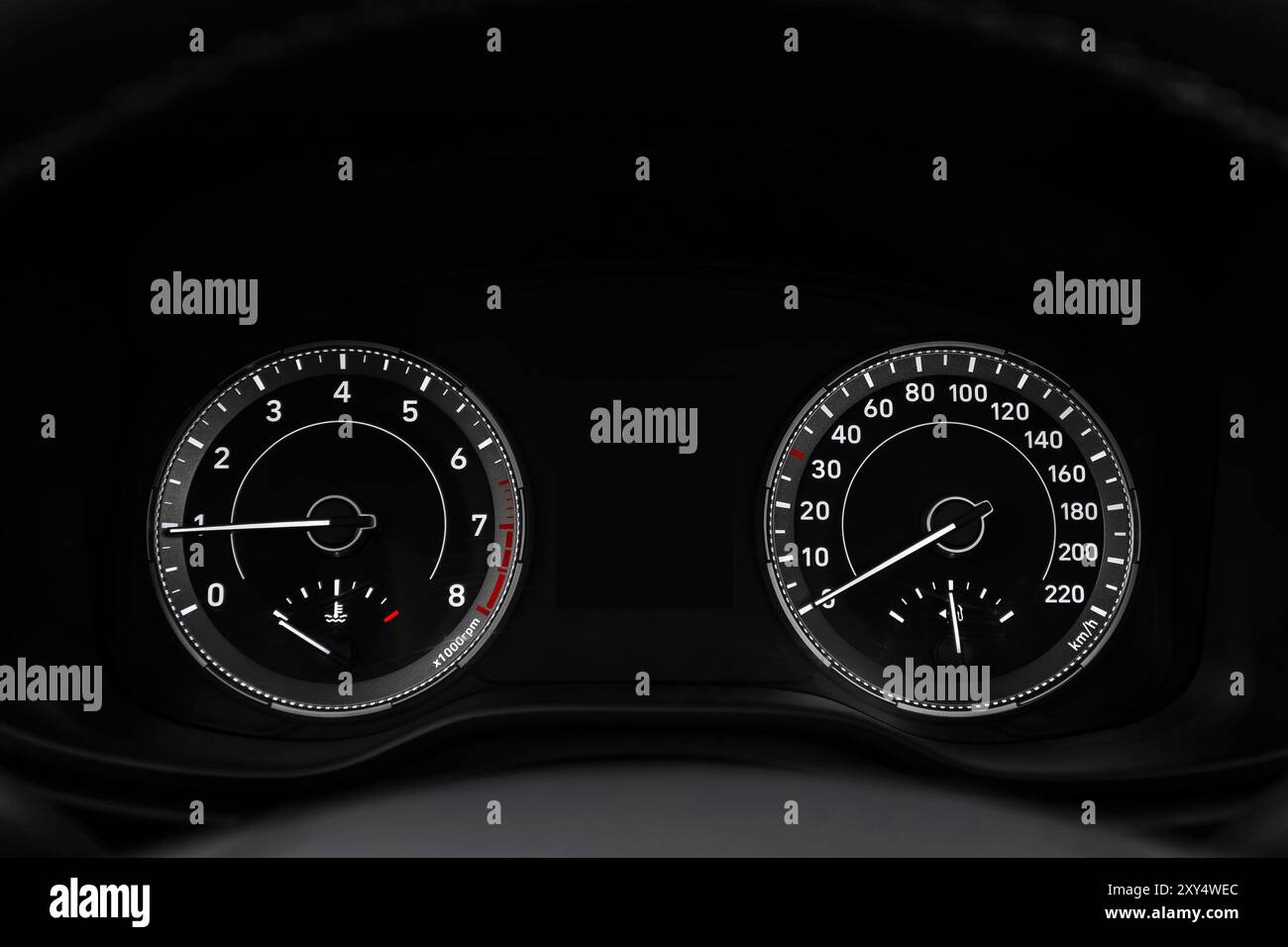 Car dashboard with white backlight: Odometer, speedometer, tachometer ...