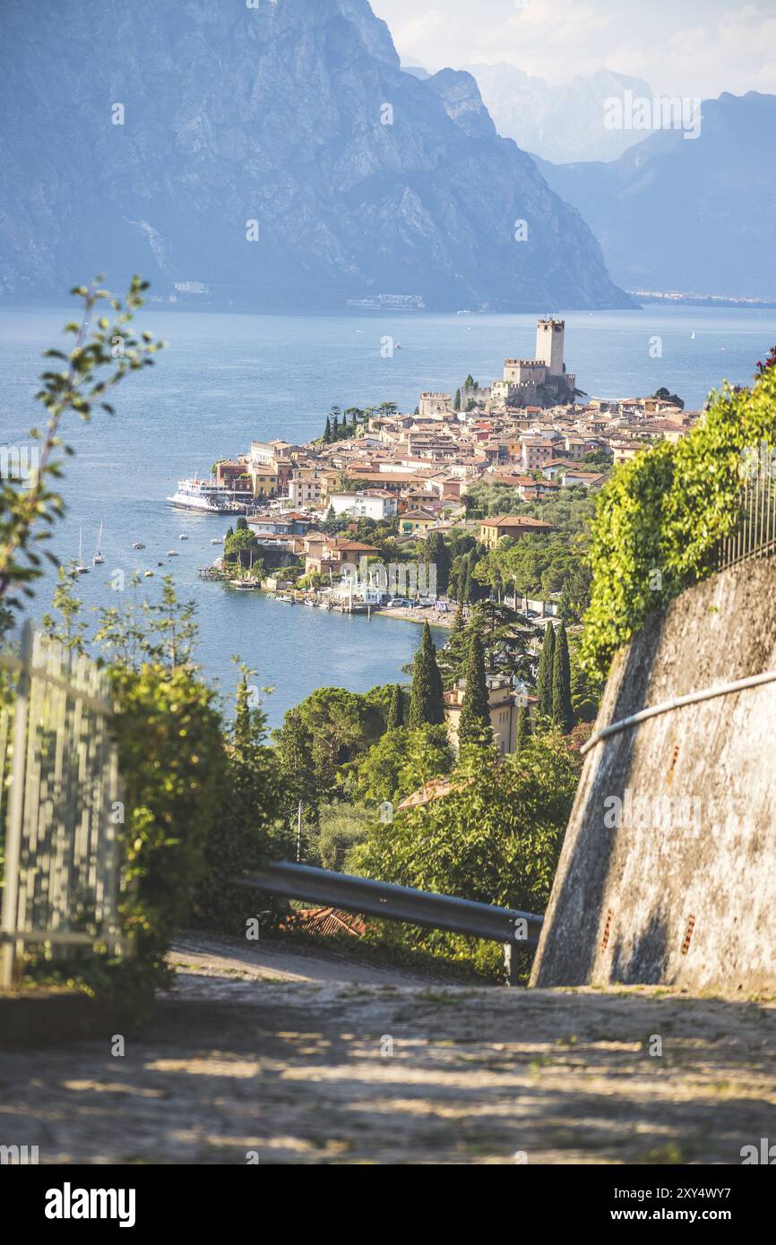 Cute idyllic Italian village, moutain road and lake captured from above ...
