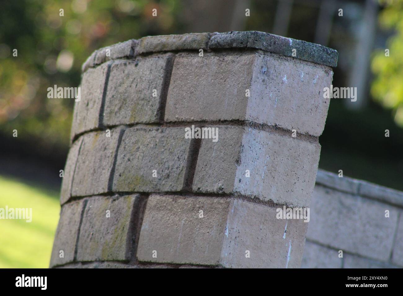 curved brick wall in garden Stock Photo - Alamy