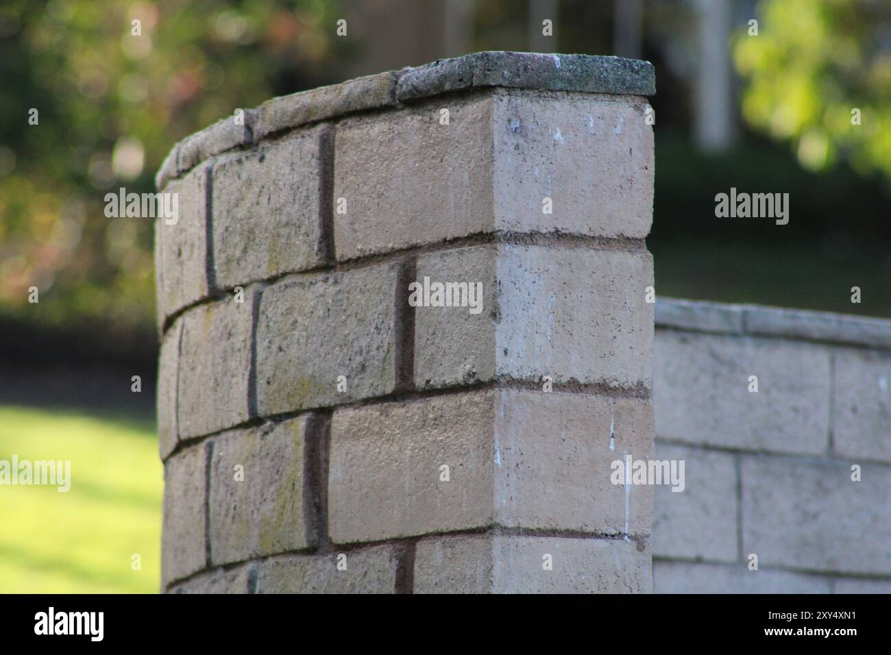 curved brick wall in garden Stock Photo - Alamy