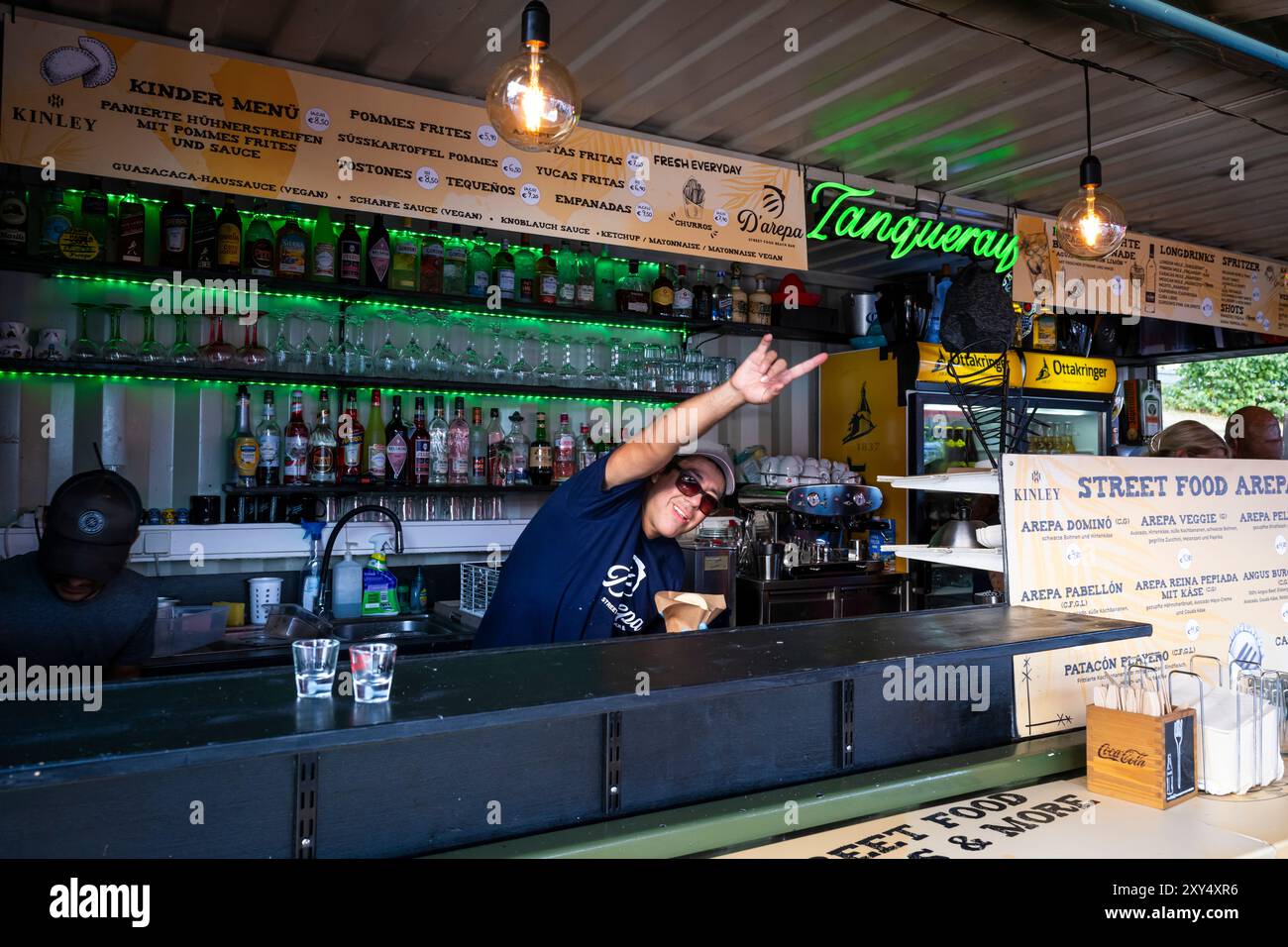 Bartender of the Bar D'Arepa greets the photographer with the Hang ...
