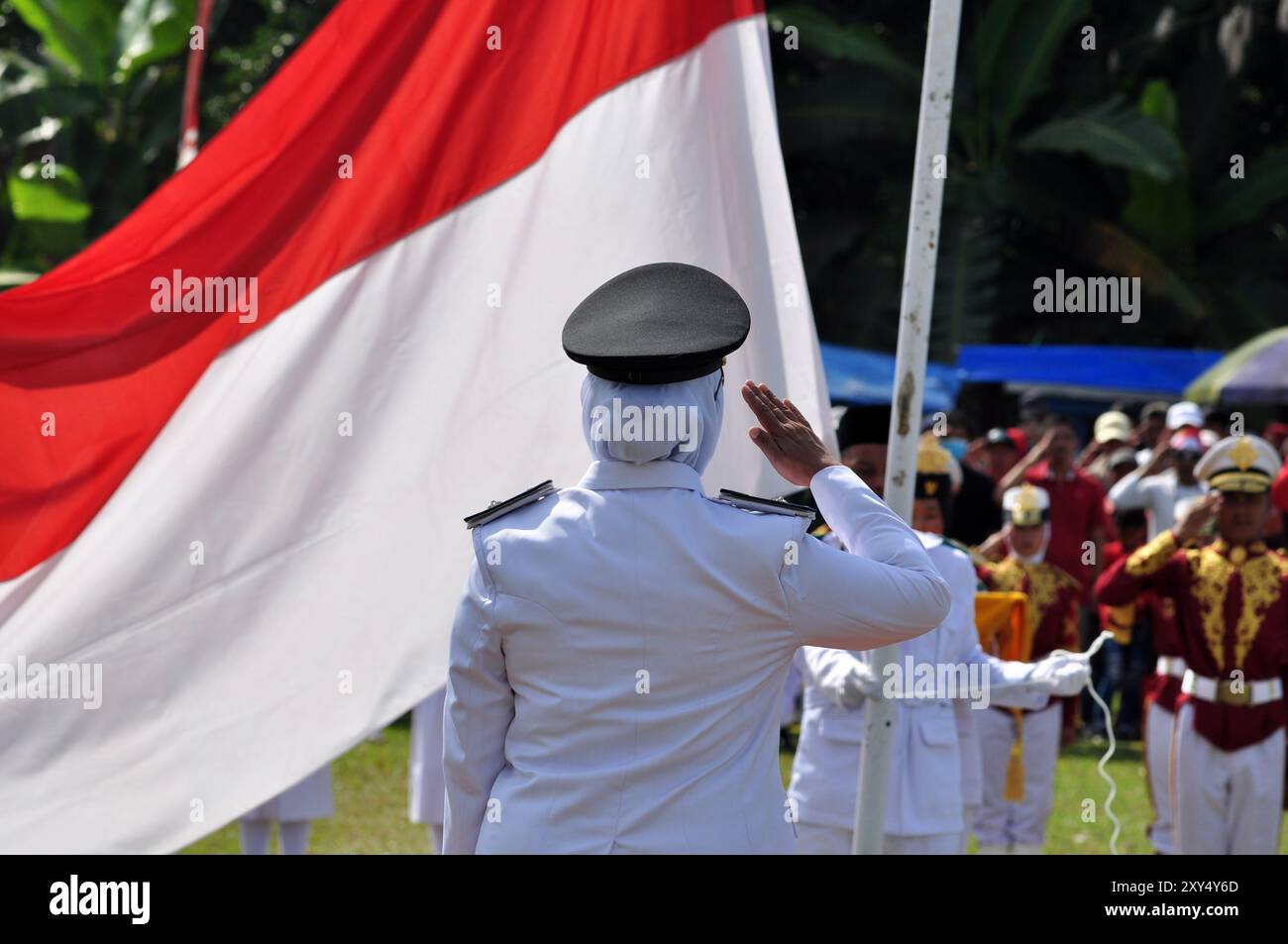 West Java, Indonesia - August 17, 2024 : A female village head salutes ...