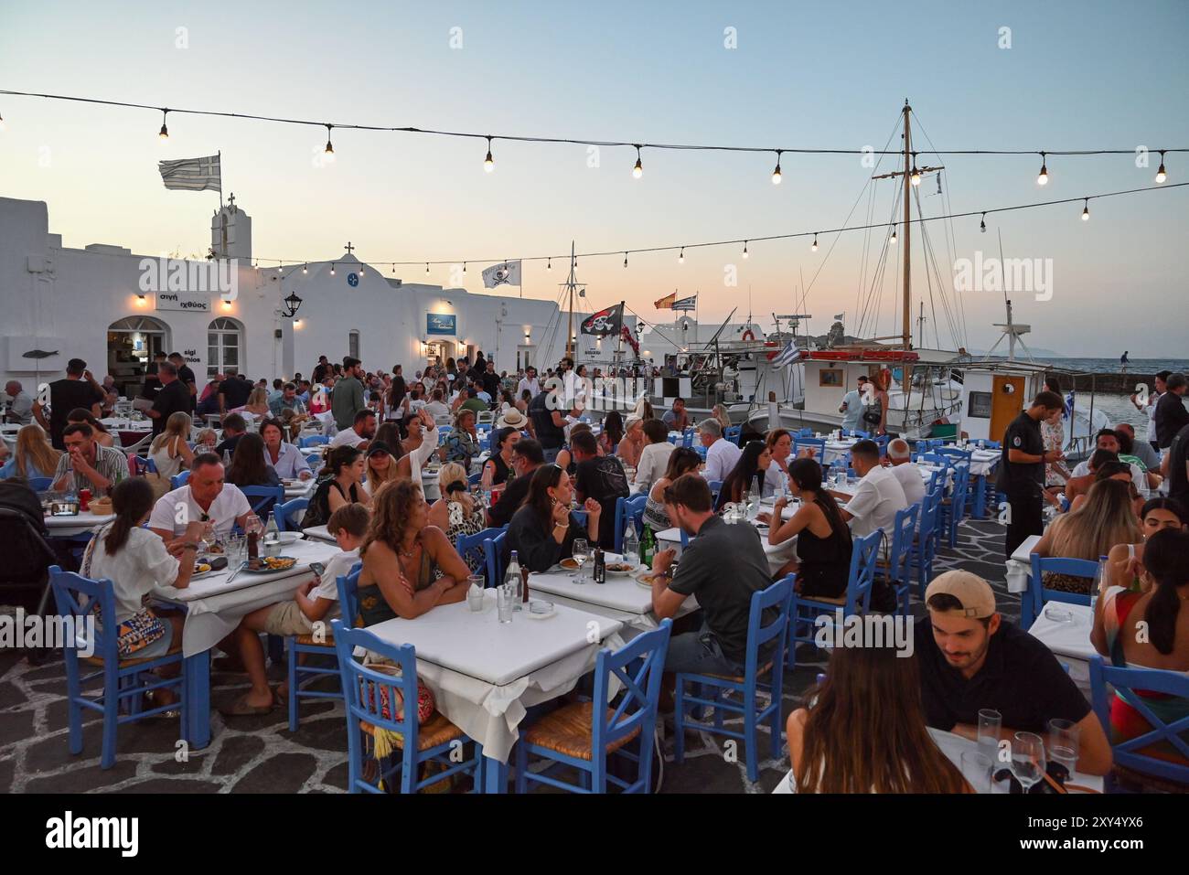Paros, Greece. 18th August 2024. Tourists are dining at waterfront ...