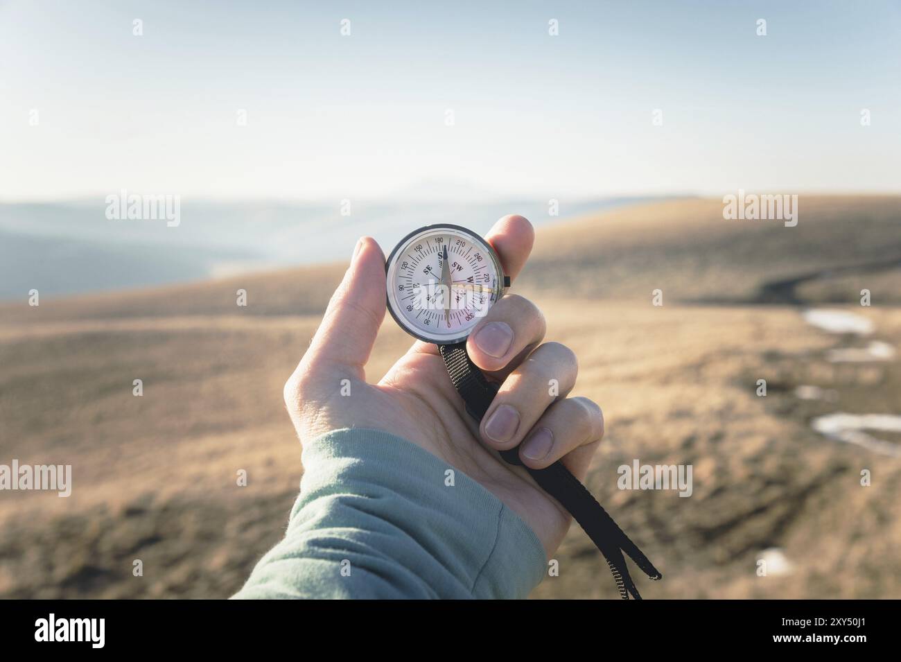 Vintage compass in hand hi-res stock photography and images - Alamy